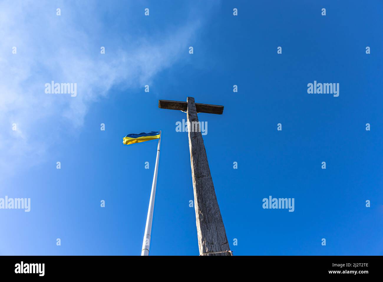 The crucifixion of Jesus Christ and the flag of Ukraine against the ...