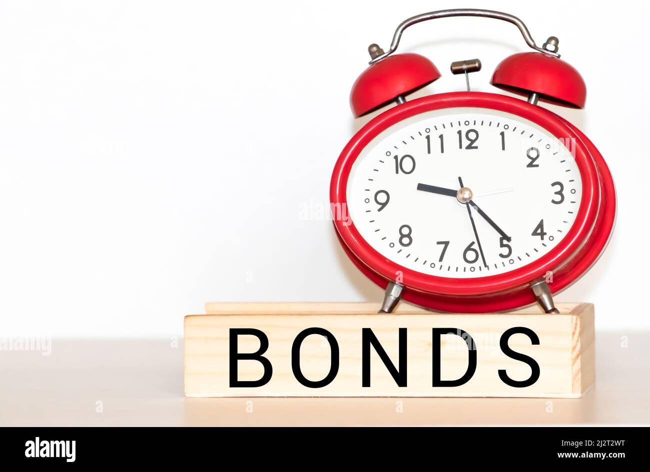 Word BONDS in wooden block on US Dollar bills Stock Photo - Alamy