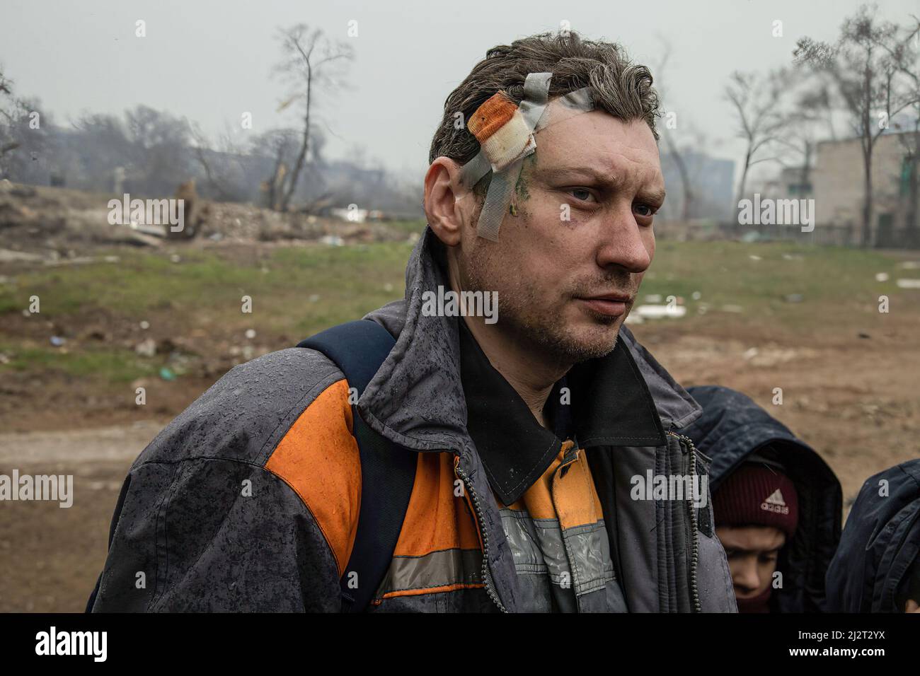A wounded man seen at a neighbourhood, destroyed by the Ukraine-Russian ...
