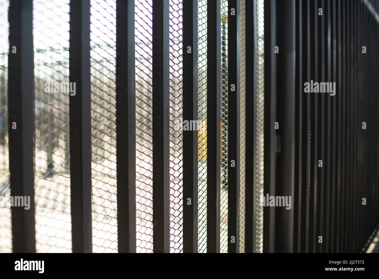 Black steel fence. Fence made of rods. Mesh to protect territory Stock ...