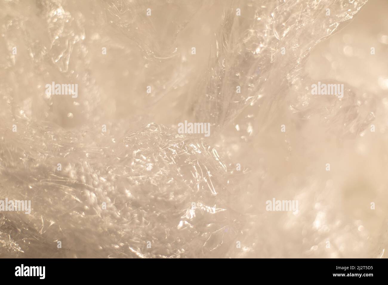 White crumpled film made of plastic. Plastic bag texture. Background is ...