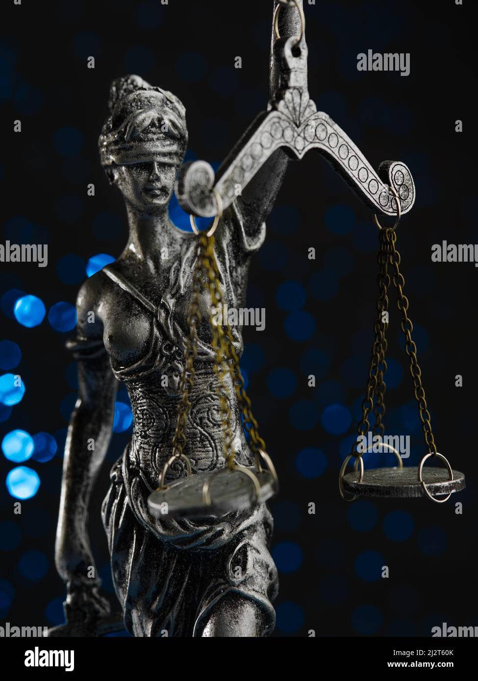 Close-up. Bronze figurine of the goddess of justice - Themis on a dark ...