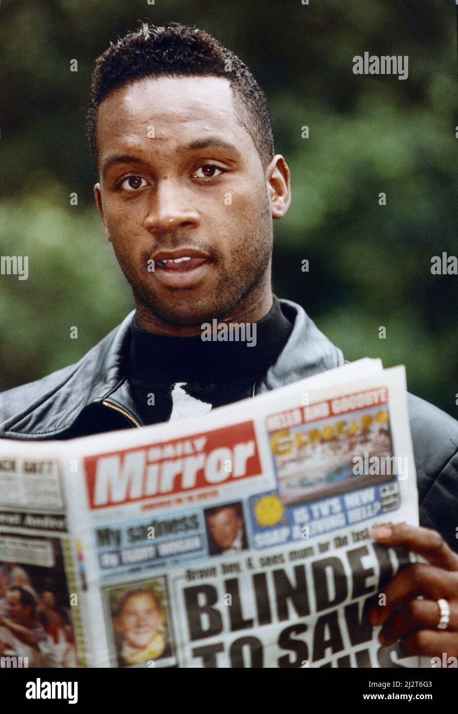 British boxer Nigel Benn with a copy of the Daily Mirror.3rd July 1992 ...