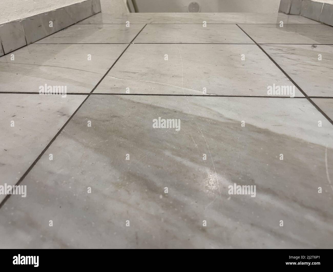 Scratched white marble floor with gray joints Stock Photo - Alamy