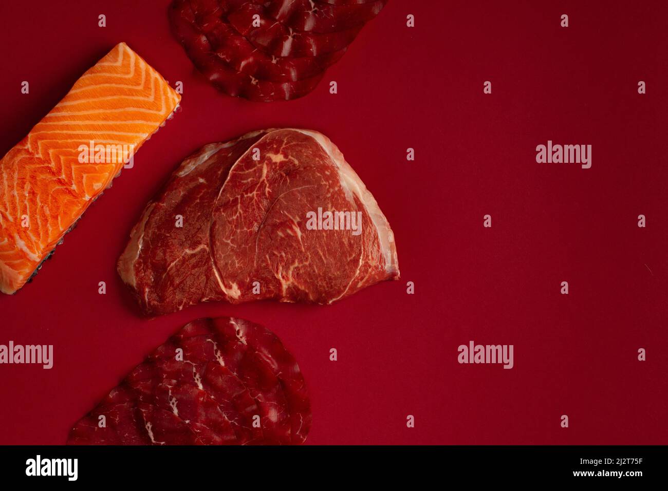 fresh mix meat . serving on a blood background Stock Photo - Alamy