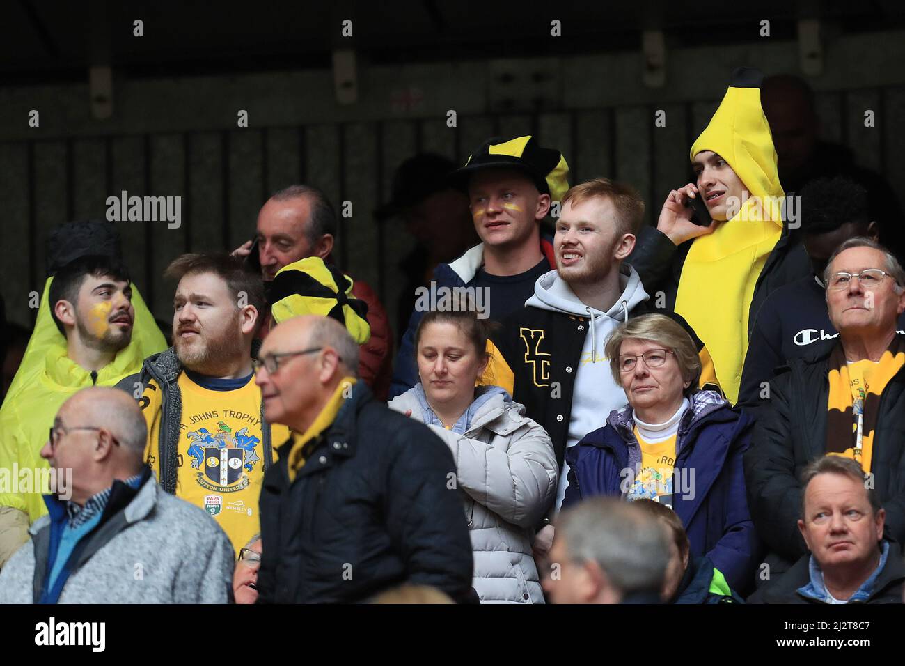 Sutton United fans dressed as a banana Stock Photo - Alamy