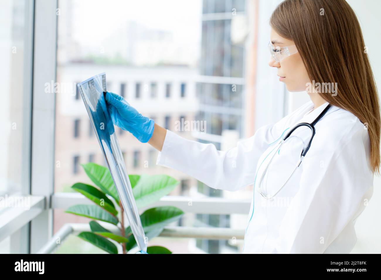 Doctor check up x-ray film of the brain by ct scan brain at patient ...