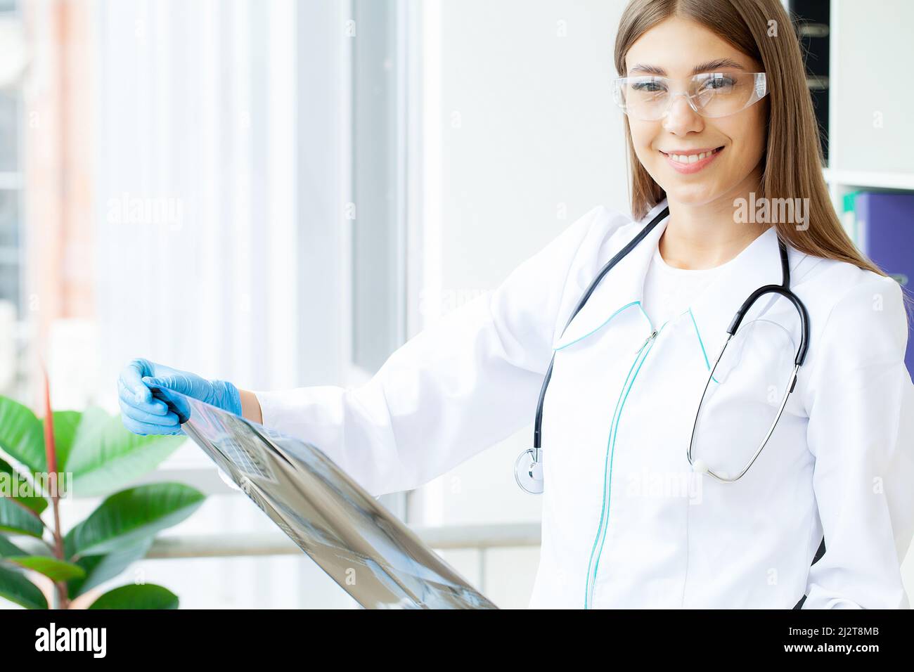 Doctor check up x-ray film of the brain by ct scan brain at patient ...