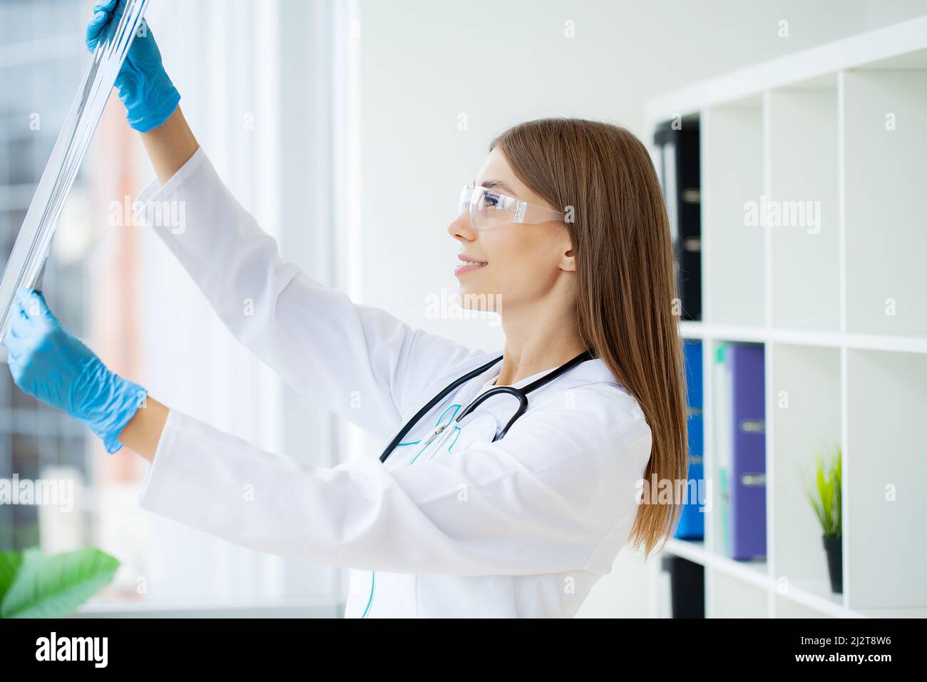 Doctor check up x-ray film of the brain by ct scan brain at patient ...