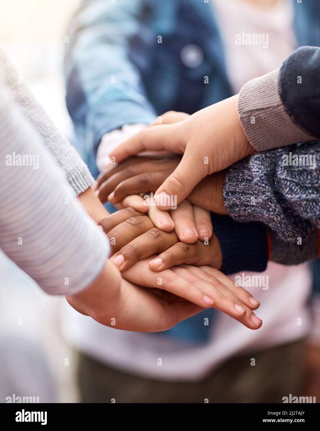 Friends stick together. Shot of a group of unrecognizable elementary ...