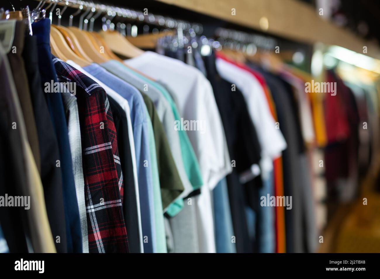 Men clothes in modern garments shop Stock Photo - Alamy