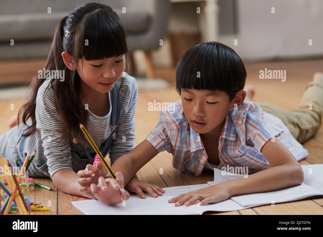 Students helping each other children hi-res stock photography and ...