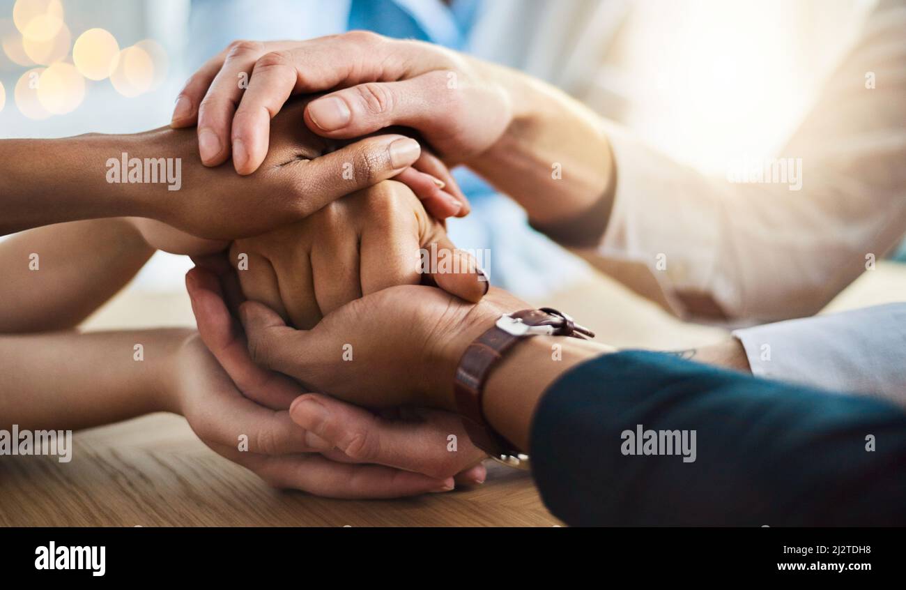 Trust and support. Cropped shot of a group of unrecognizable ...