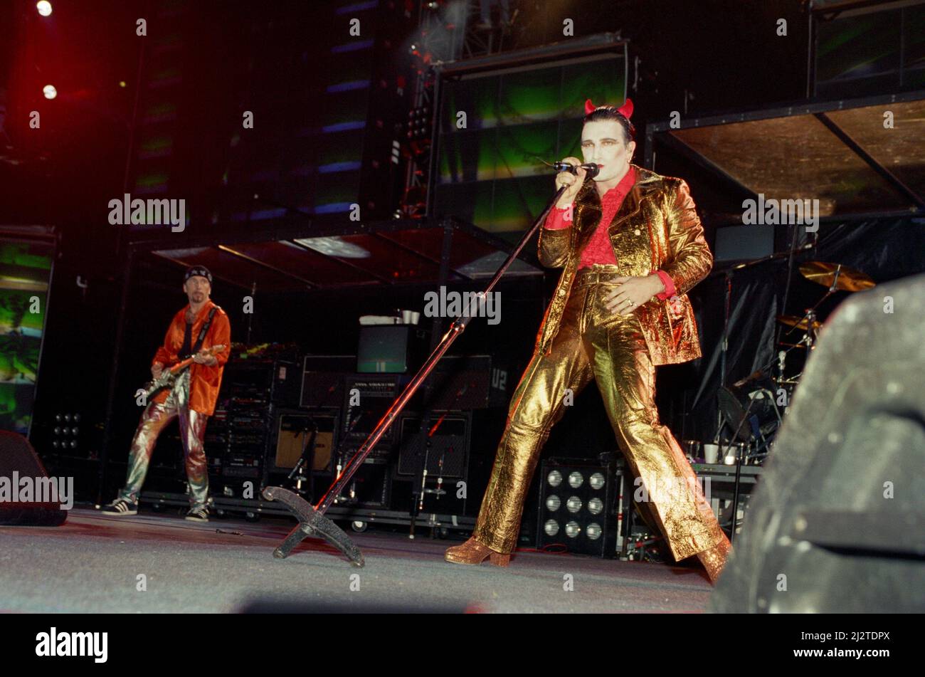 U2 in concert on the Zoo TV Tour, Wembley Stadium. Bono performing on ...