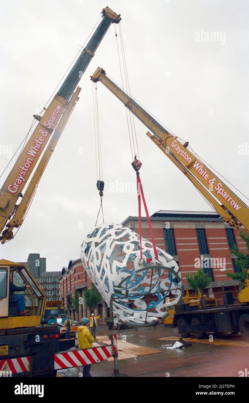 The sculpture 'Bottle of Notes' is lifted off its low loader in the ...