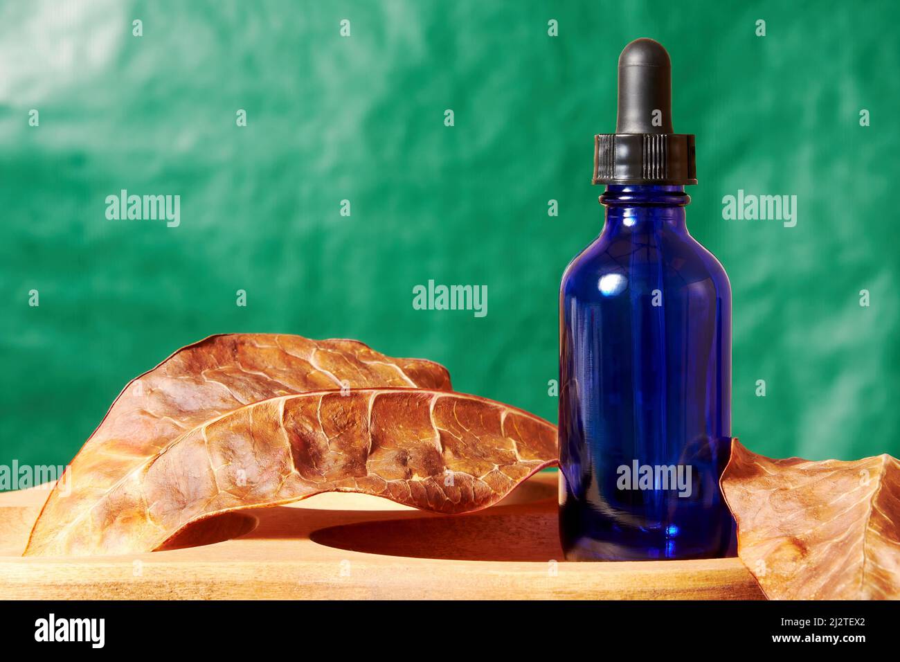 Empty blue bottle with pipette for tonic and body milk on the ...