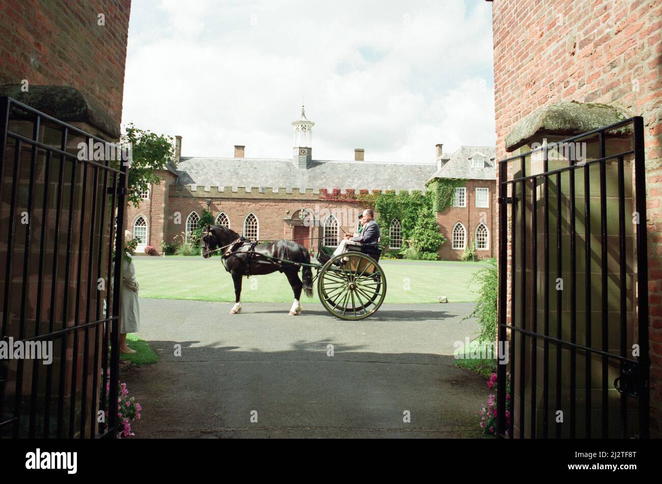 Judges in horse-drawn carriages view the village of Hartlebury ...