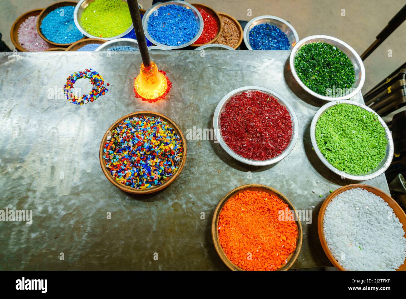 Colored glass frit used in glassblowing projects Stock Photo - Alamy