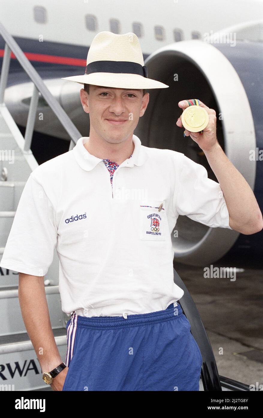 British cyclist Chris Boardman poses on arrival at Heathrow Airport as ...