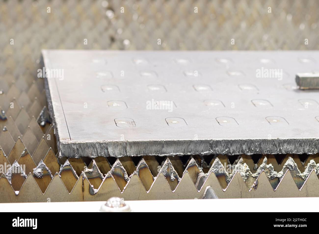 After laser cut steel plate on machine ; engineering background Stock ...