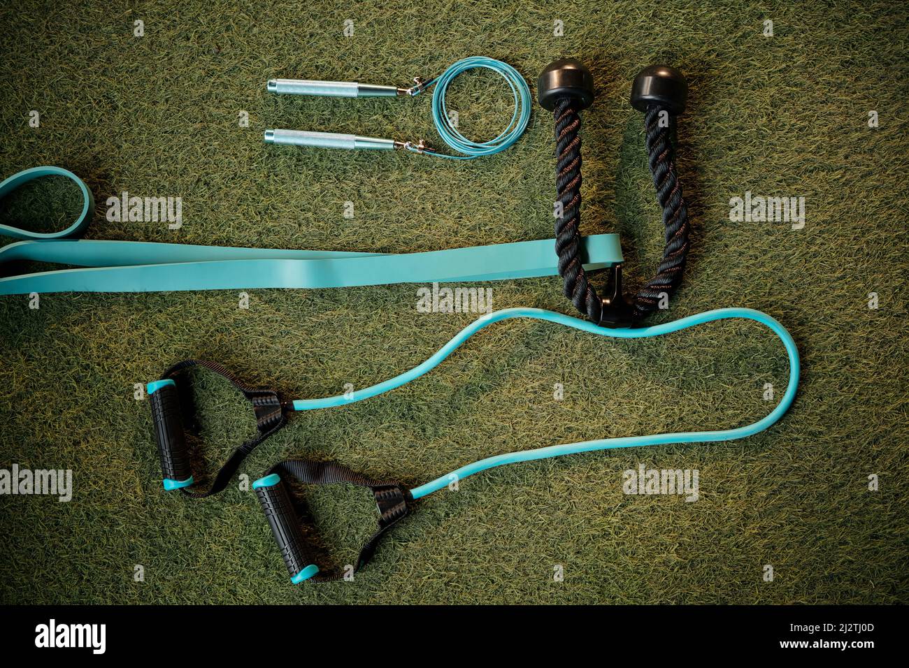 Workout equipment like triceps rope and various resistance bands on ...