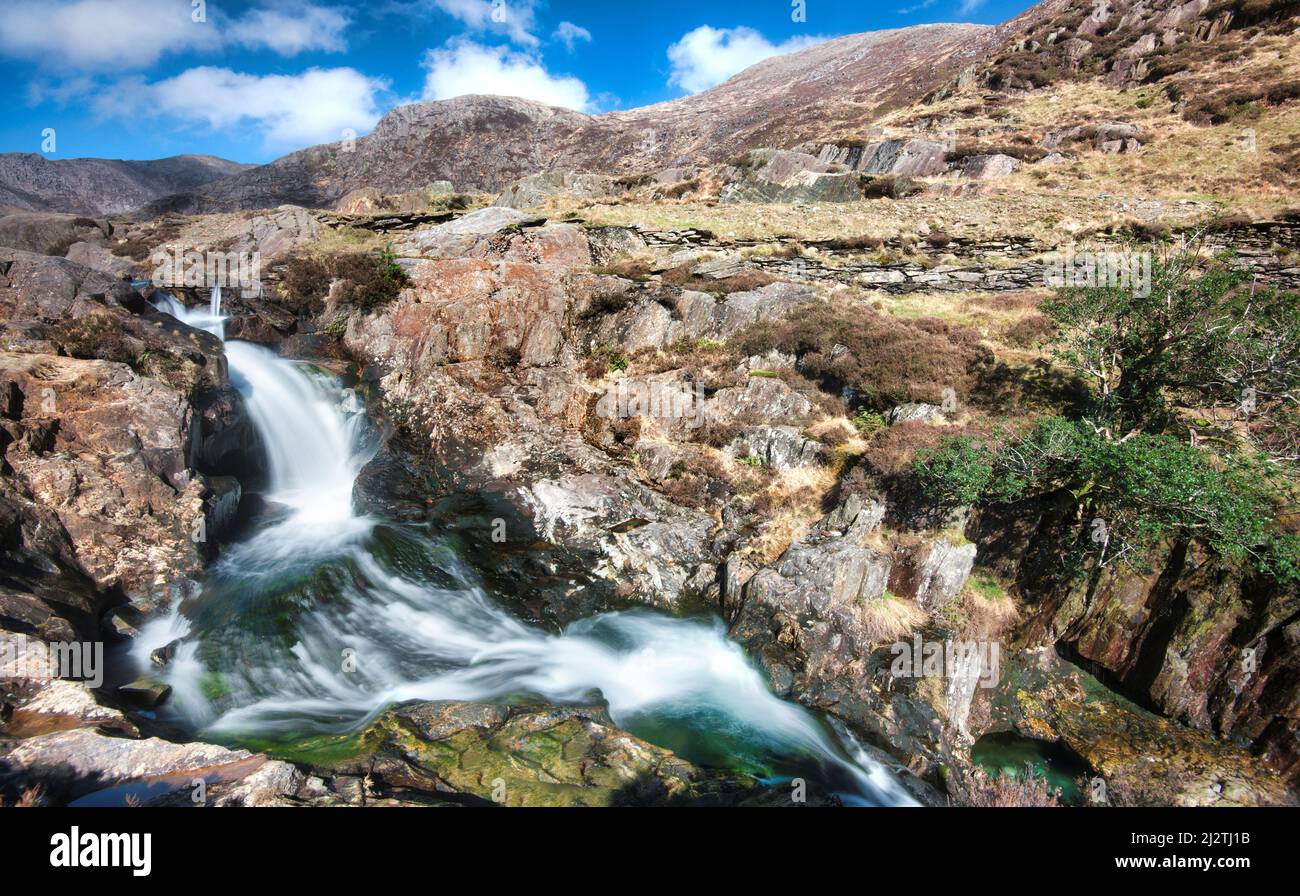 Clear fresh mountain spring rain water,flowing,rushing down from the ...