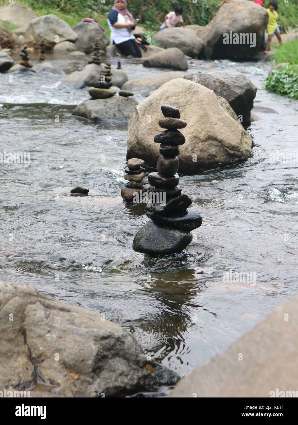 Rock balancing, the art of stacking stones piled in the river. Bogor ...