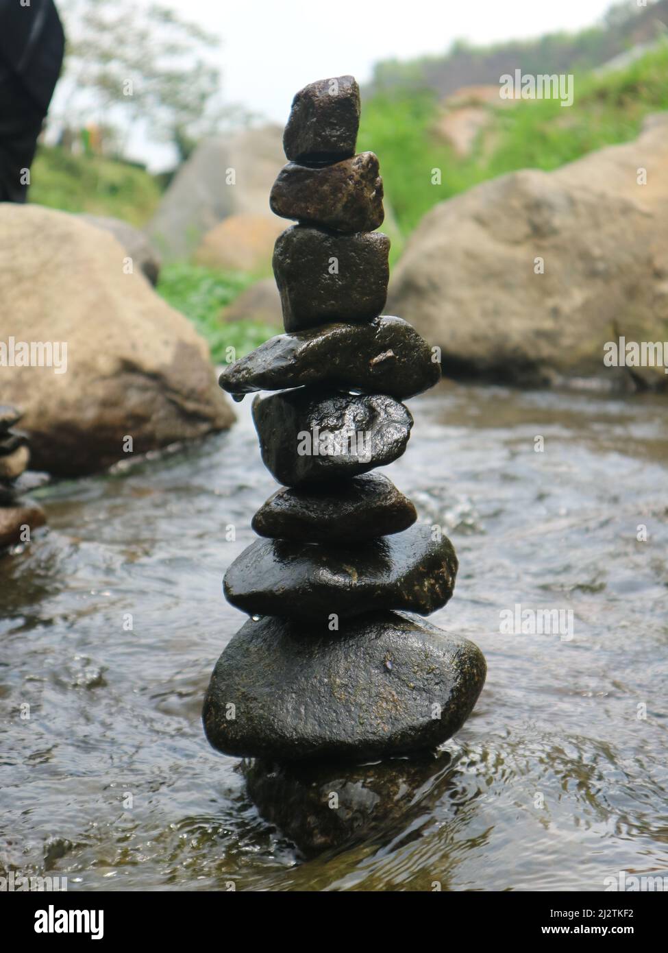 Rock balancing, the art of stacking stones piled in the river. Bogor ...