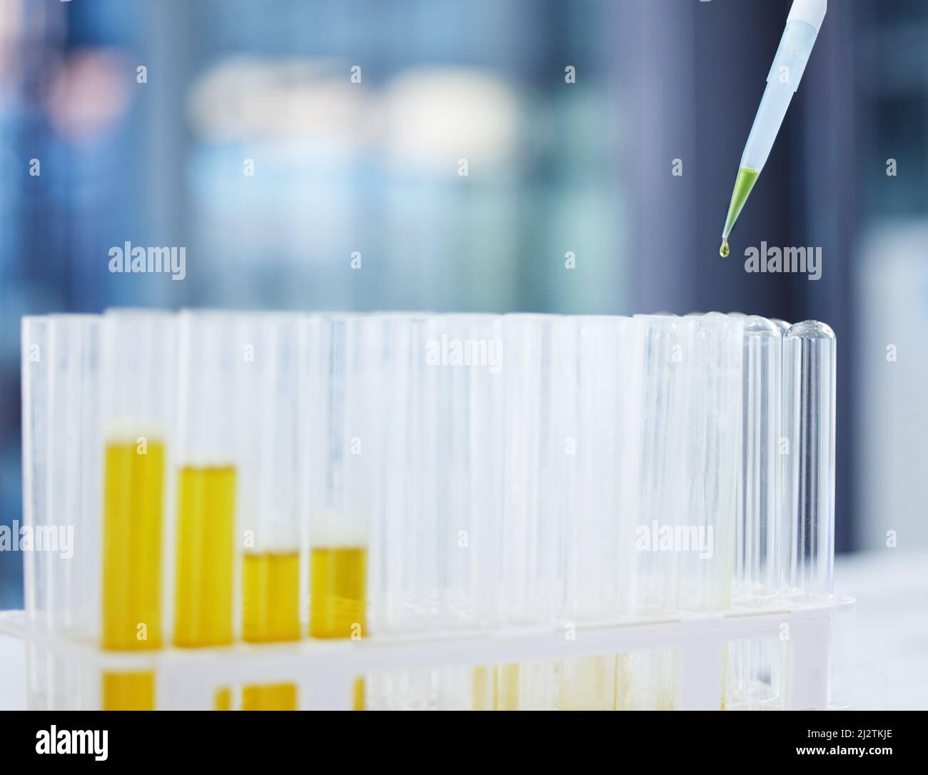 Each experiment serves a purpose. Shot of liquid being poured into ...
