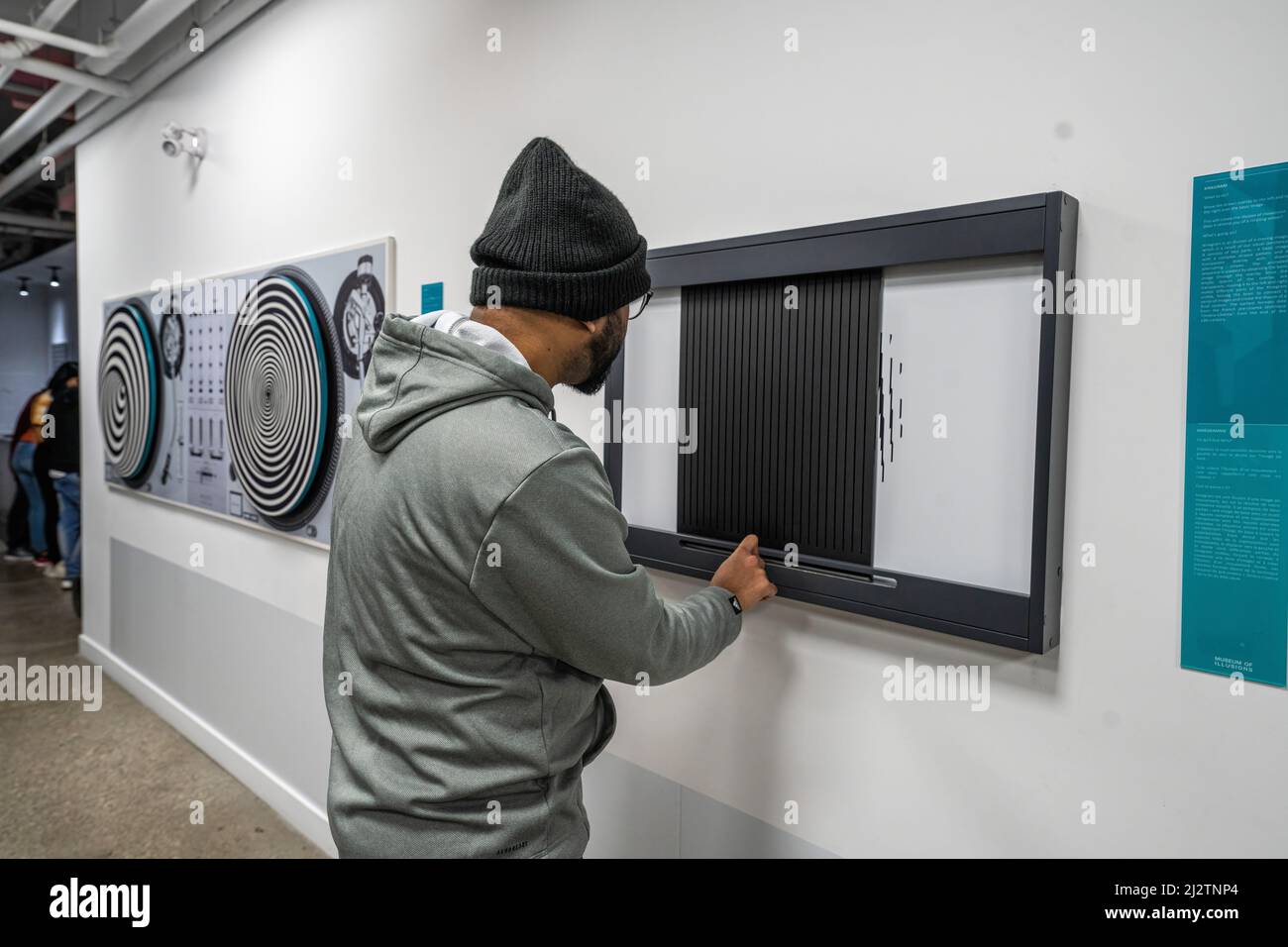 Toronto, Canada. 02nd Apr, 2022. A young man plays with an interactive ...