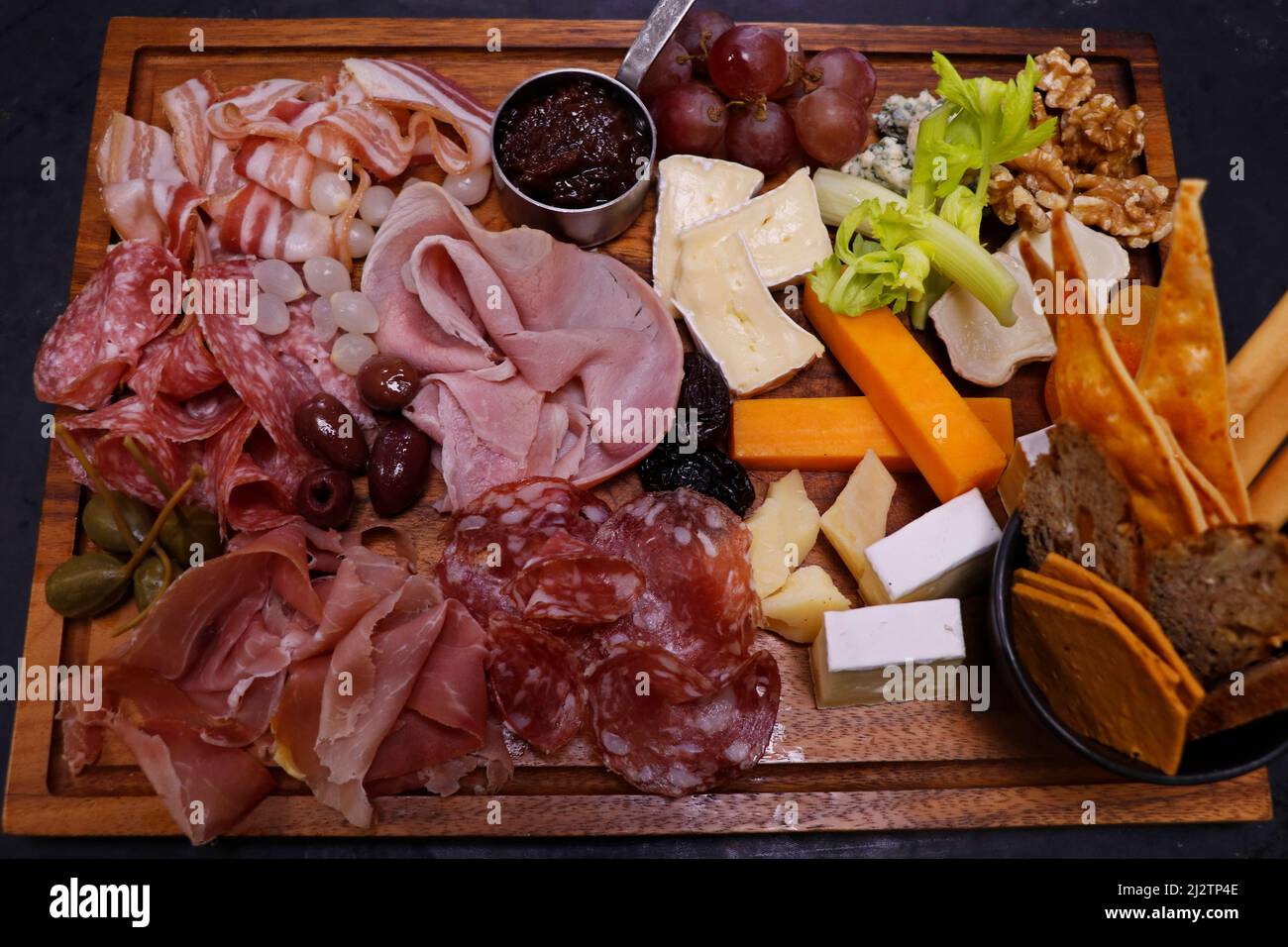 assorted cheese and cold meat platter or board with condiments Stock ...