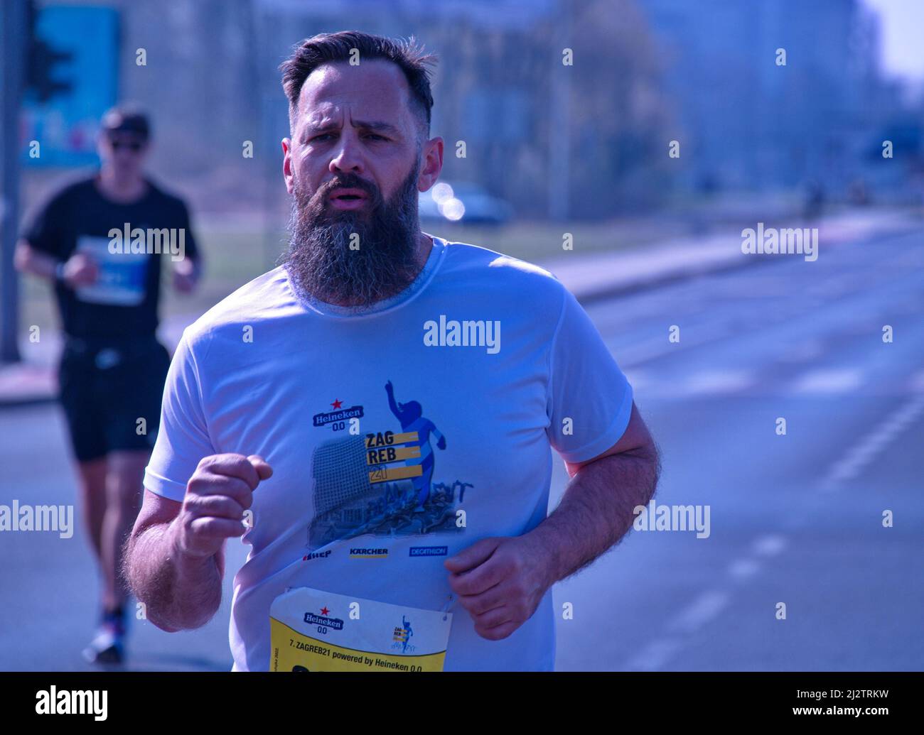 Active man with beard running marathon race Stock Photo - Alamy
