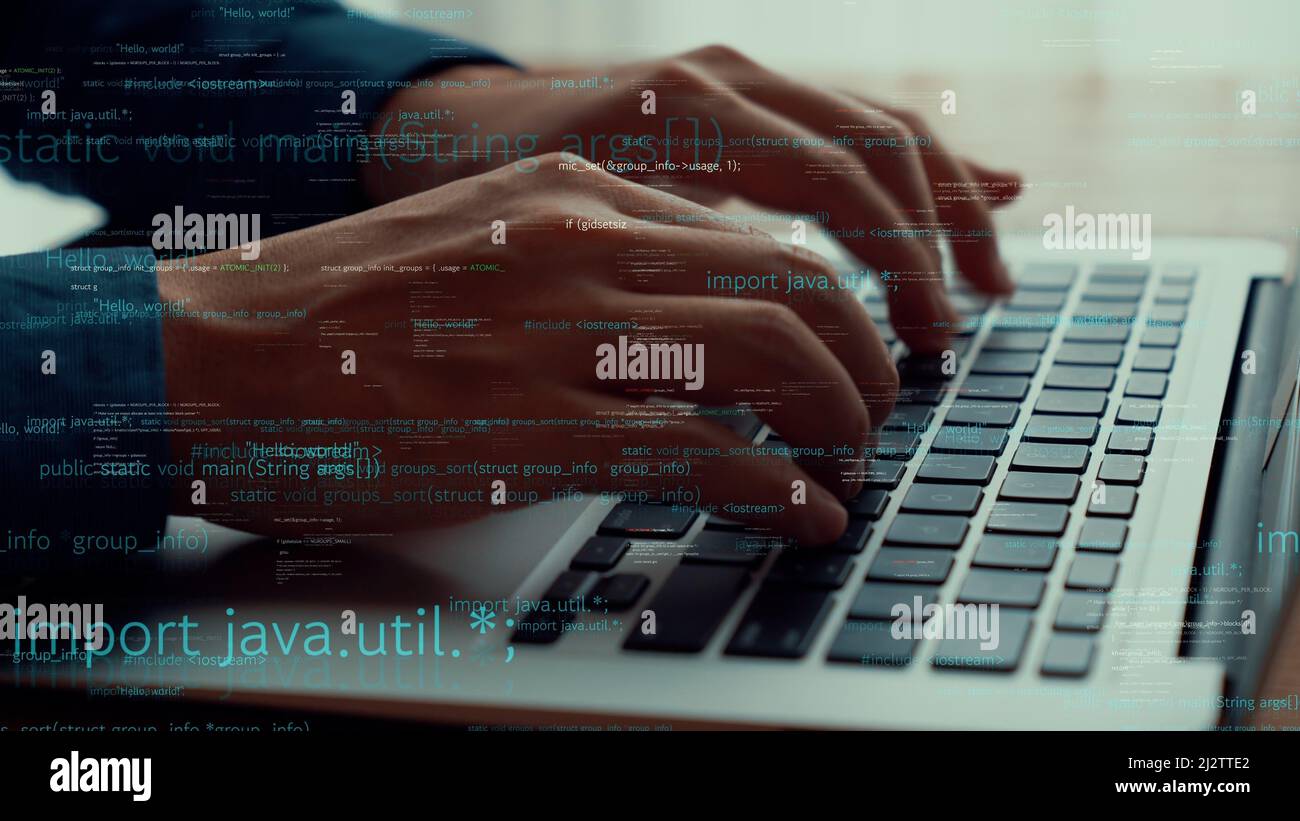 Computer Programmer Uses Capable Laptop Computer To Develop Programming Code Of New Software