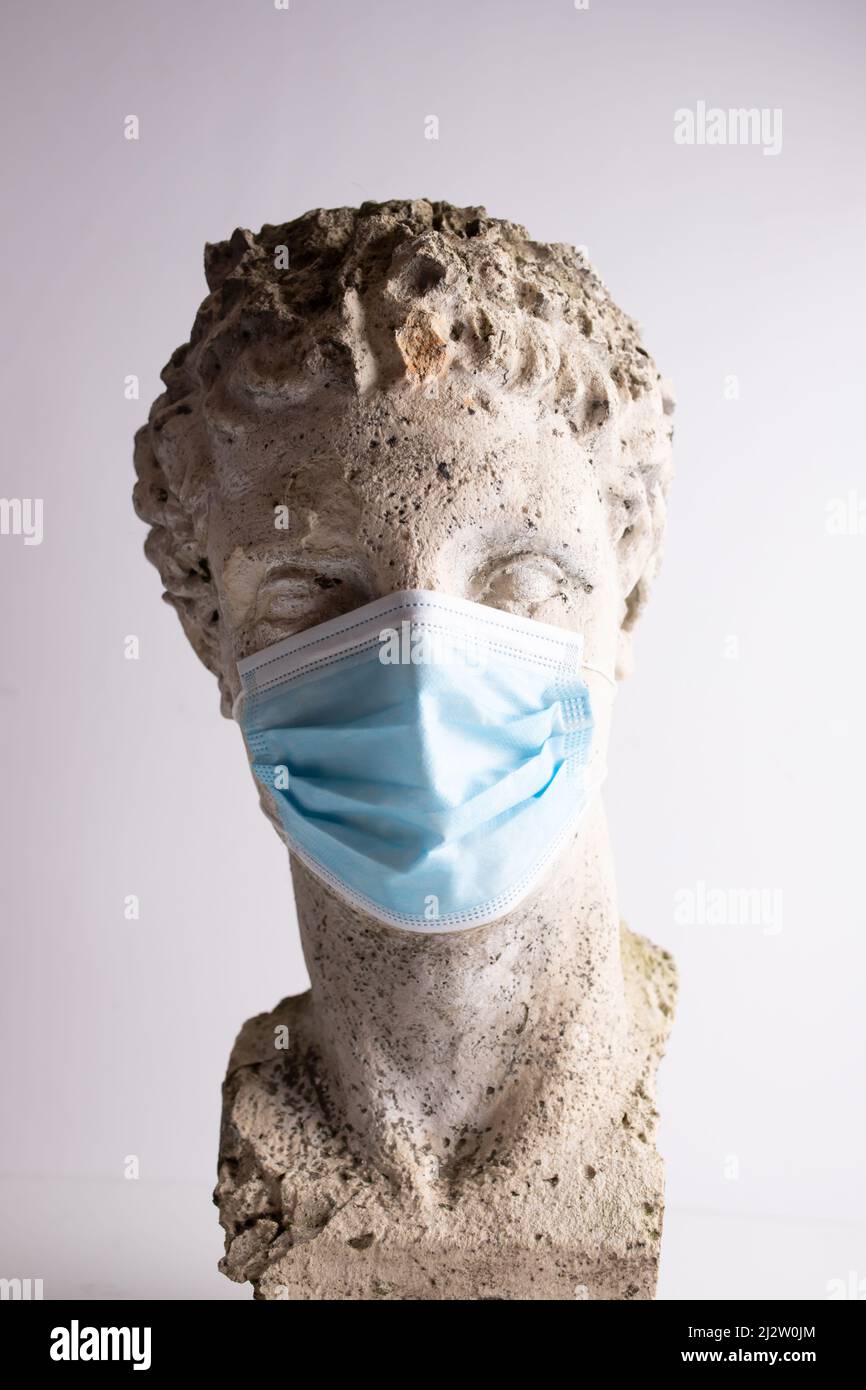 Antique gypsum statue with surgical mask. Concept of Coronavirus, COVID ...