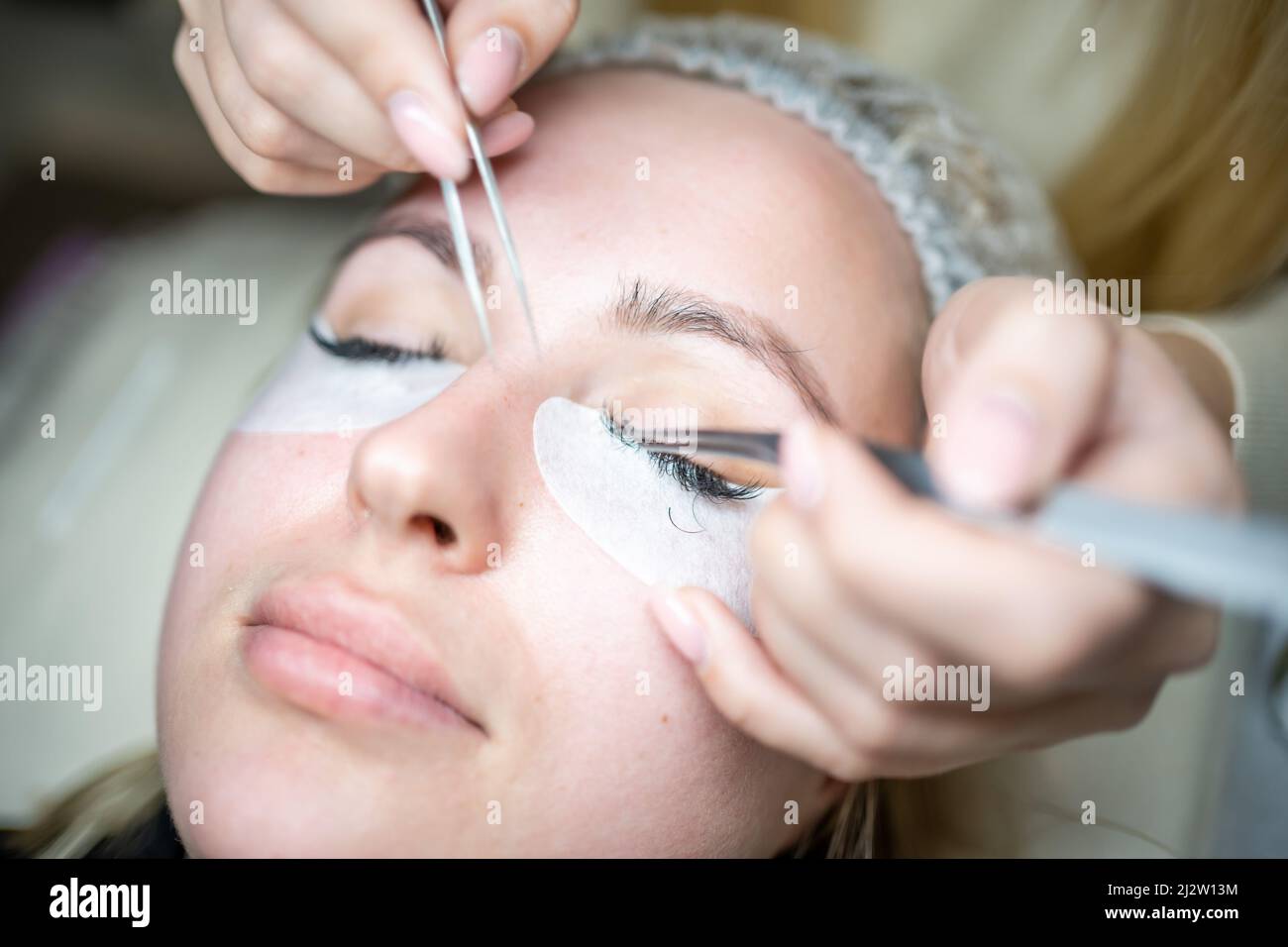 Eyelash extension procedure in beauty salon. Lashes close up. Concept ...