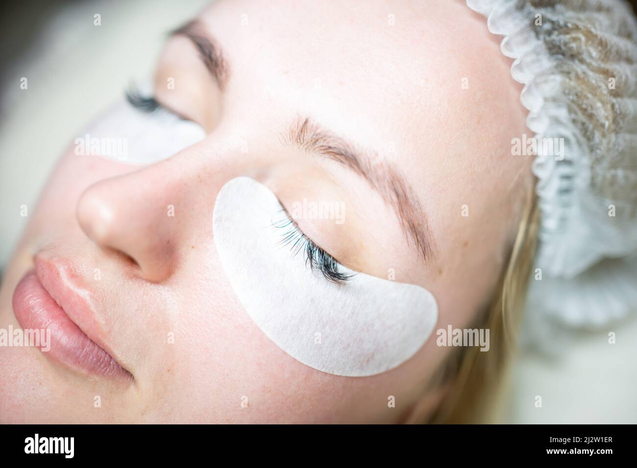 Eyelash extension procedure in beauty salon. Lashes close up. Concept ...