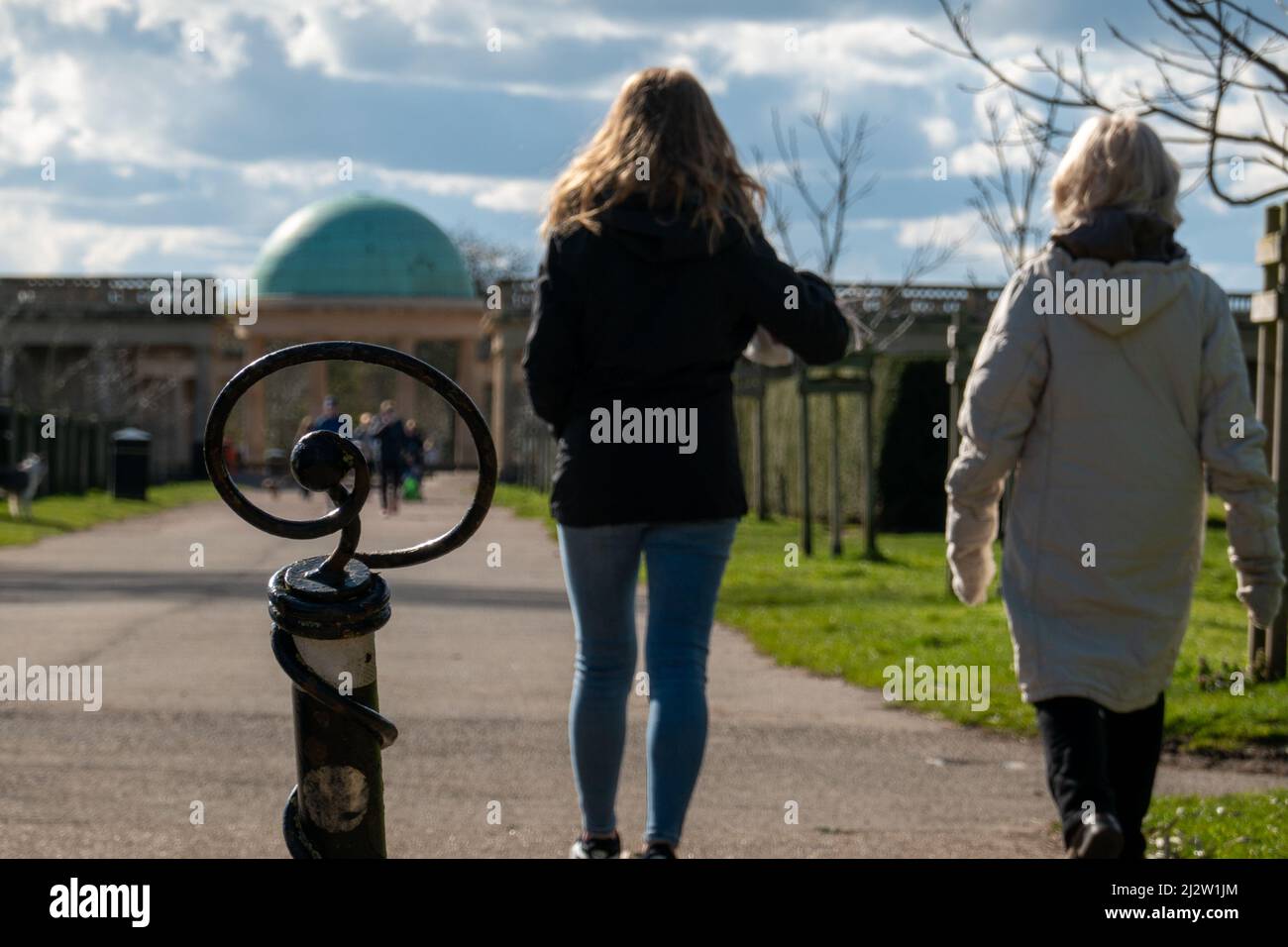Mother and daughter walking talking Stock Photo - Alamy