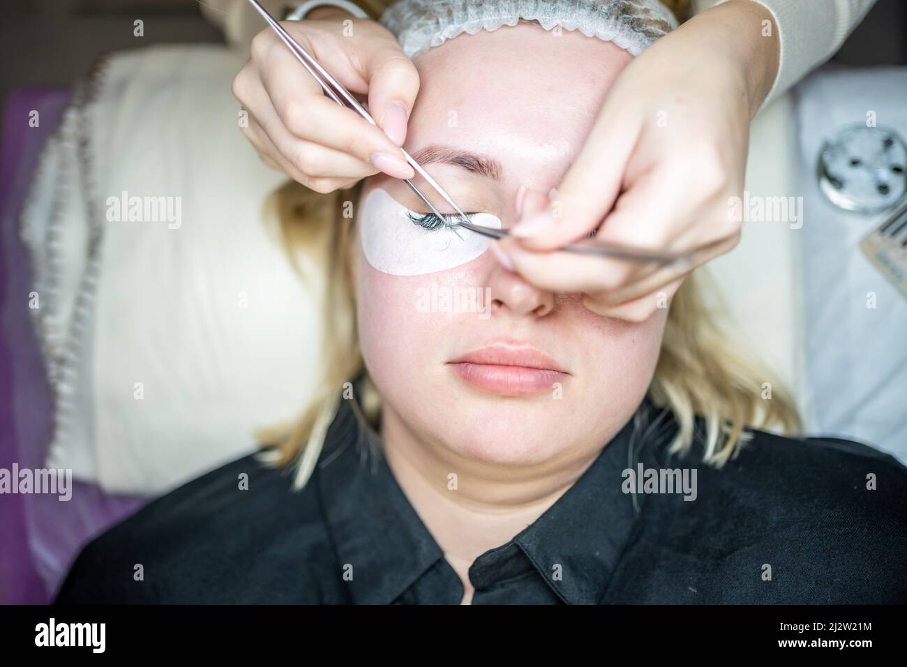 Eyelash extension procedure in beauty salon. Lashes close up. Concept ...
