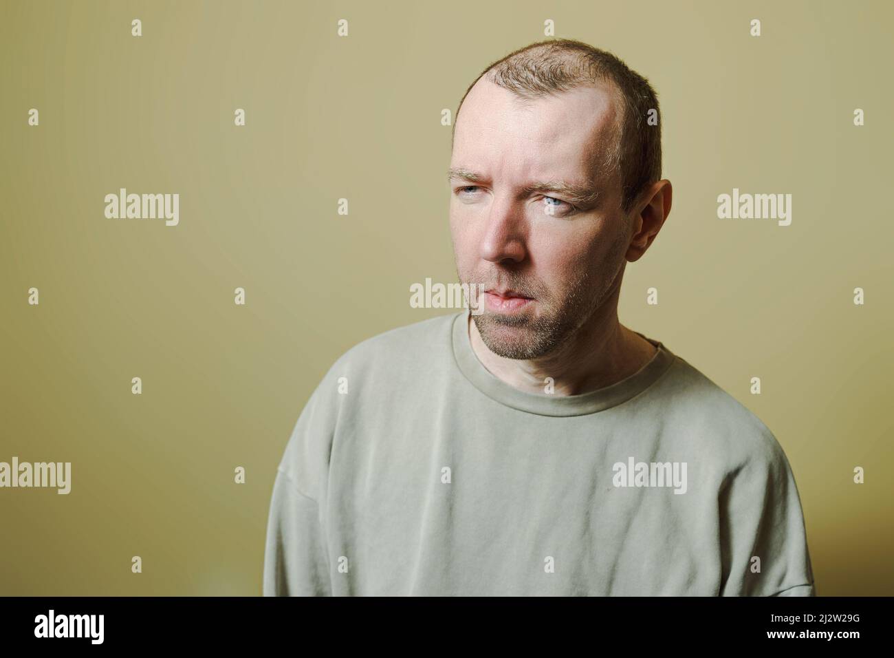 Portrait of a young man making faces. The man looks in disbelief Stock ...
