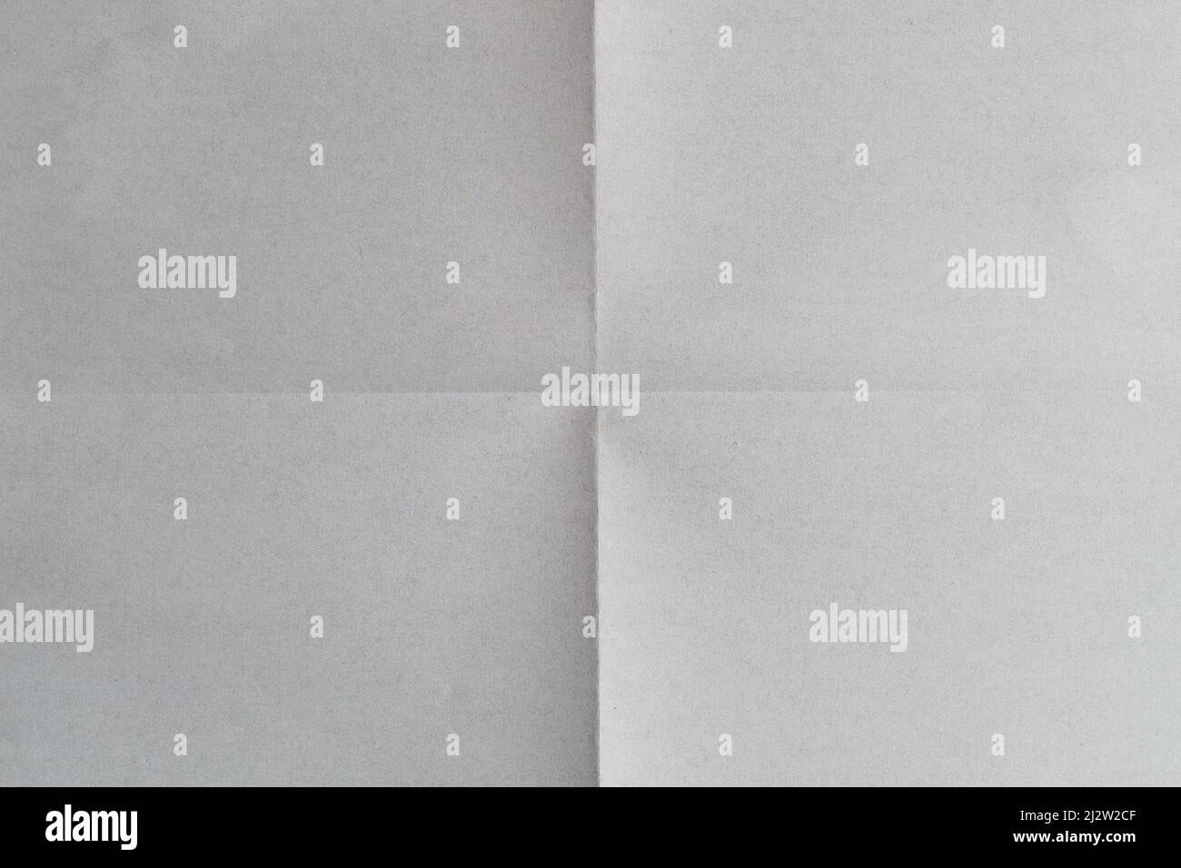 Sheet of white paper folded into four parts, paper texture background ...