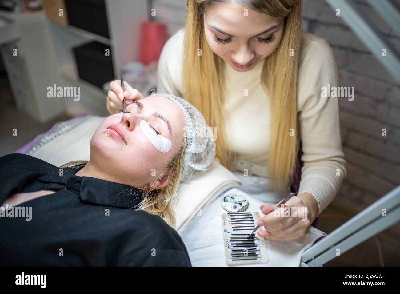 Eyelash extension procedure in beauty salon. Lashes close up. Concept ...