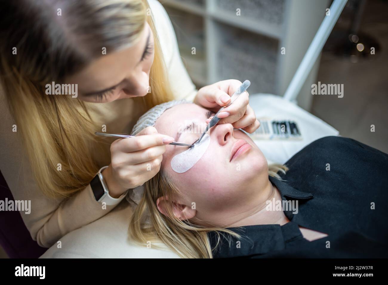 Eyelash extension procedure in beauty salon. Lashes close up. Concept ...