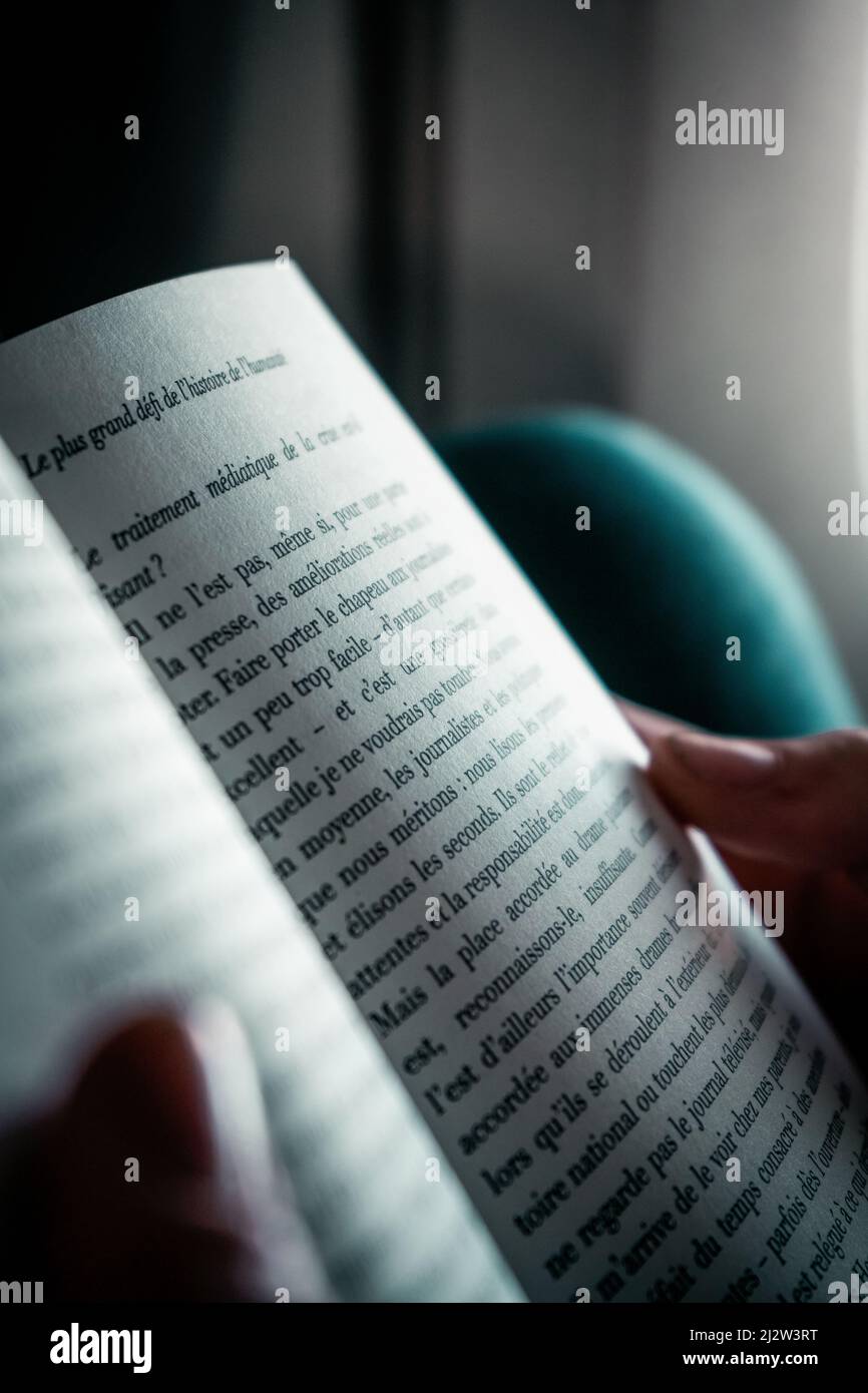 person reading a book Stock Photo - Alamy