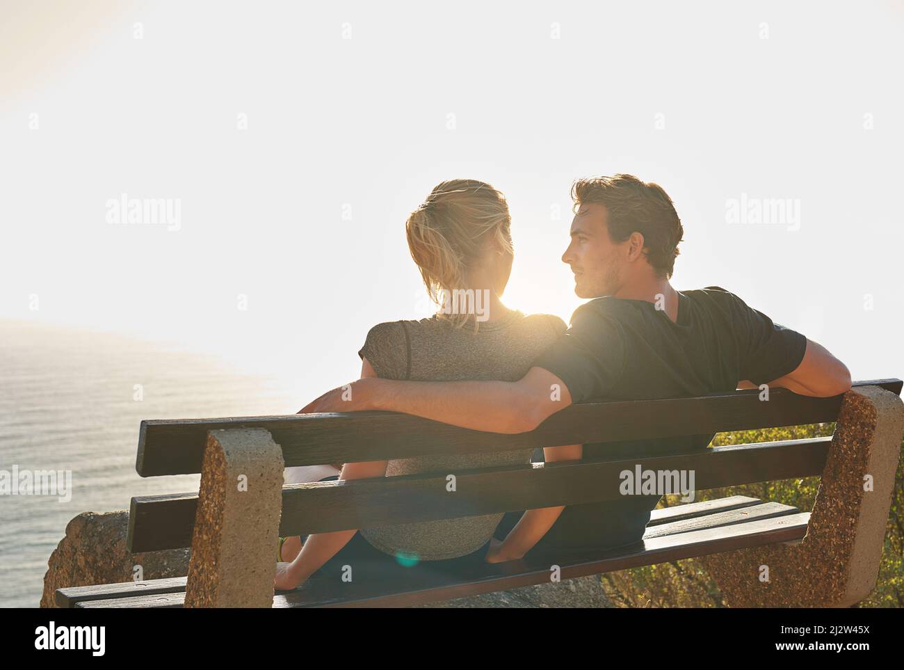 Loving couple watching the sunset hi-res stock photography and images ...