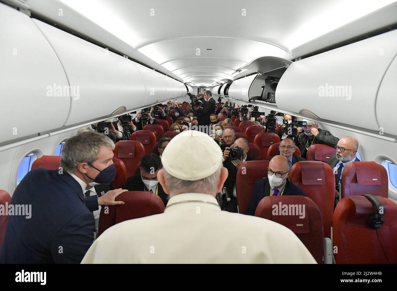 Pope Francis speaks to journalists aboard the papal plane on April 03 ...