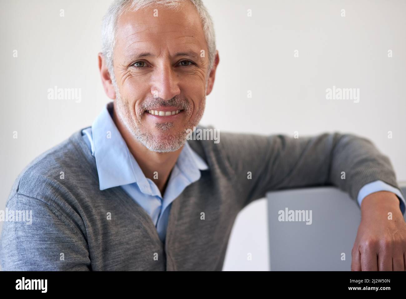 Laid back and confident. Portrait of a mature businessman leaning on ...