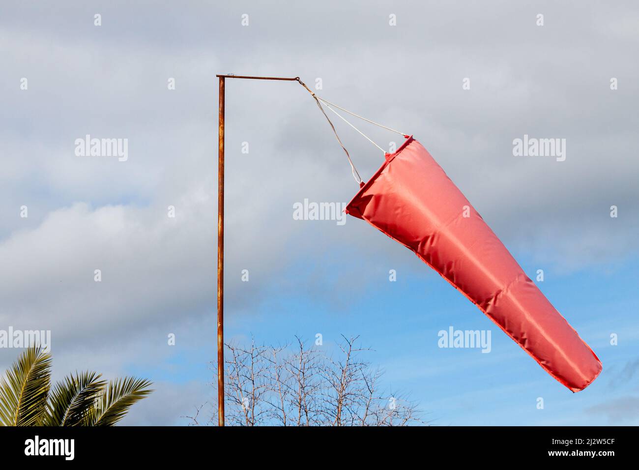Windsock indicating the direction of the wind for the flights Stock Photo - Alamy