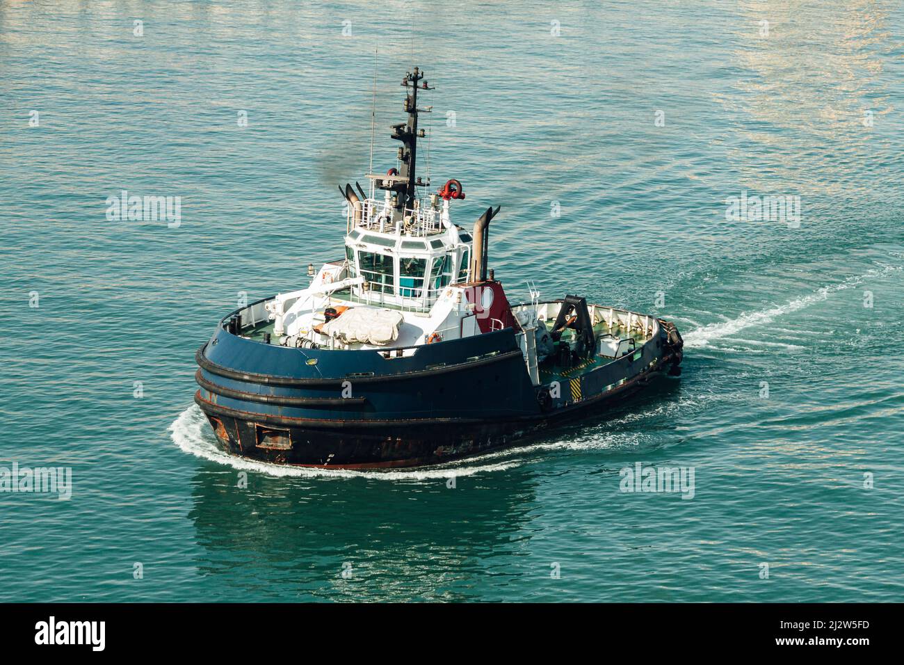 View of a boat tug sailing on the sea Stock Photo - Alamy