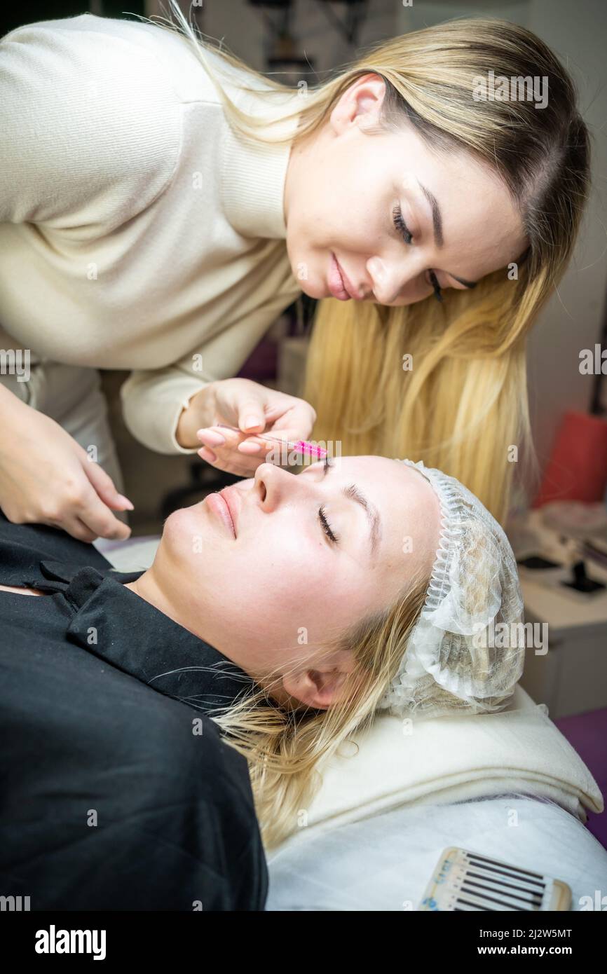 Eyelash extension procedure in beauty salon. Lashes close up. Concept ...