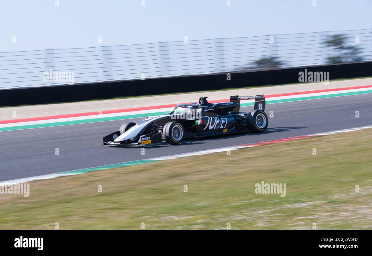 Racing car single seater speed action on asphalt racetrack with light ...